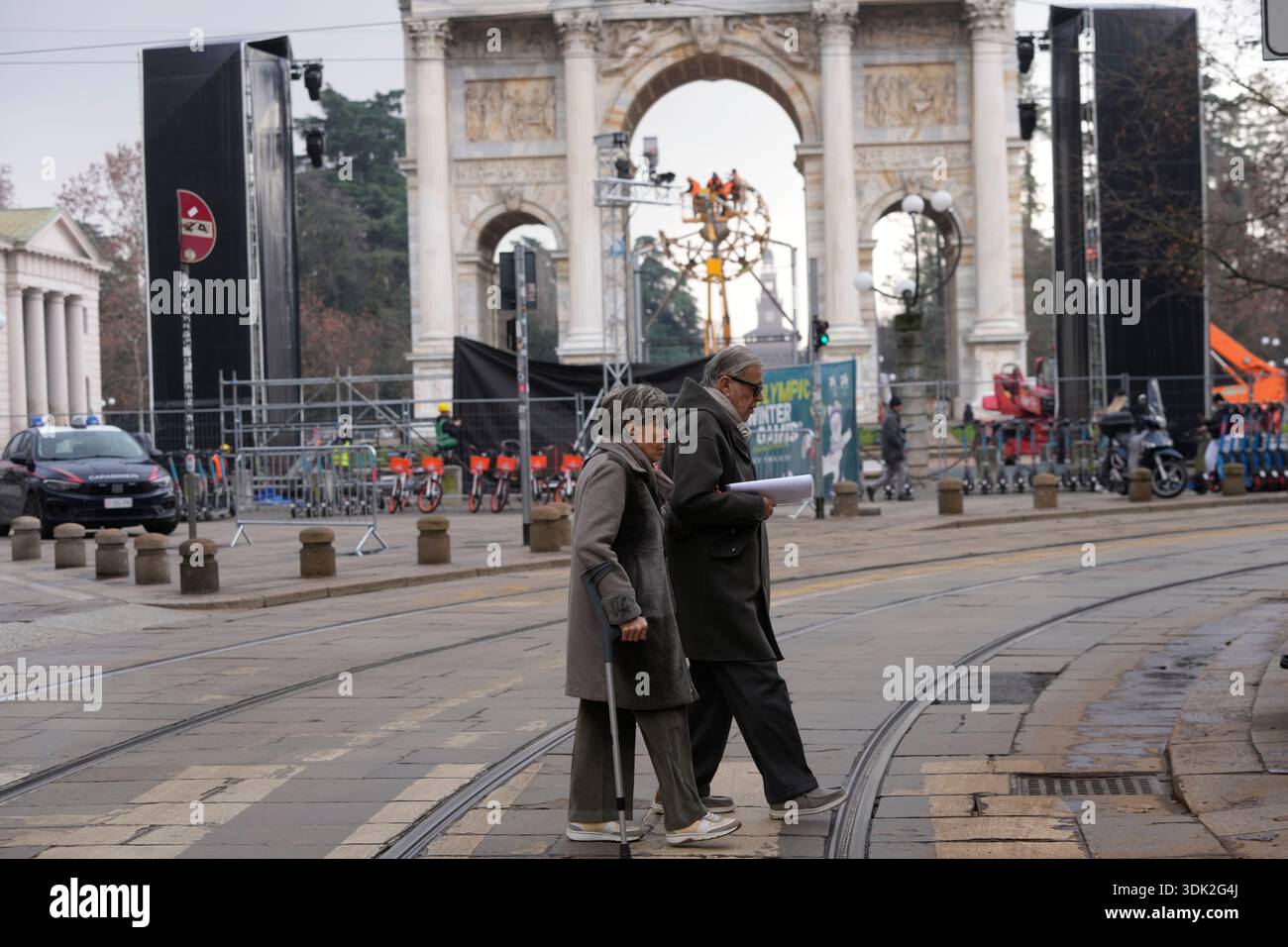 Workers set the Olympisc cauldron at the Peace arch in Milan, Italy ...