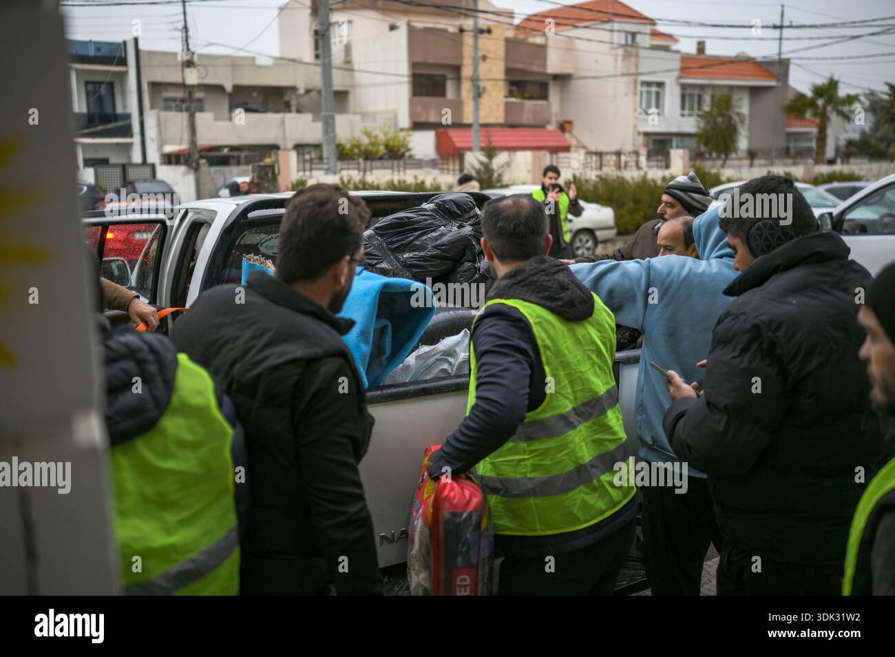 Men carry aid as residents launch a humanitarian solidarity campaign to ...