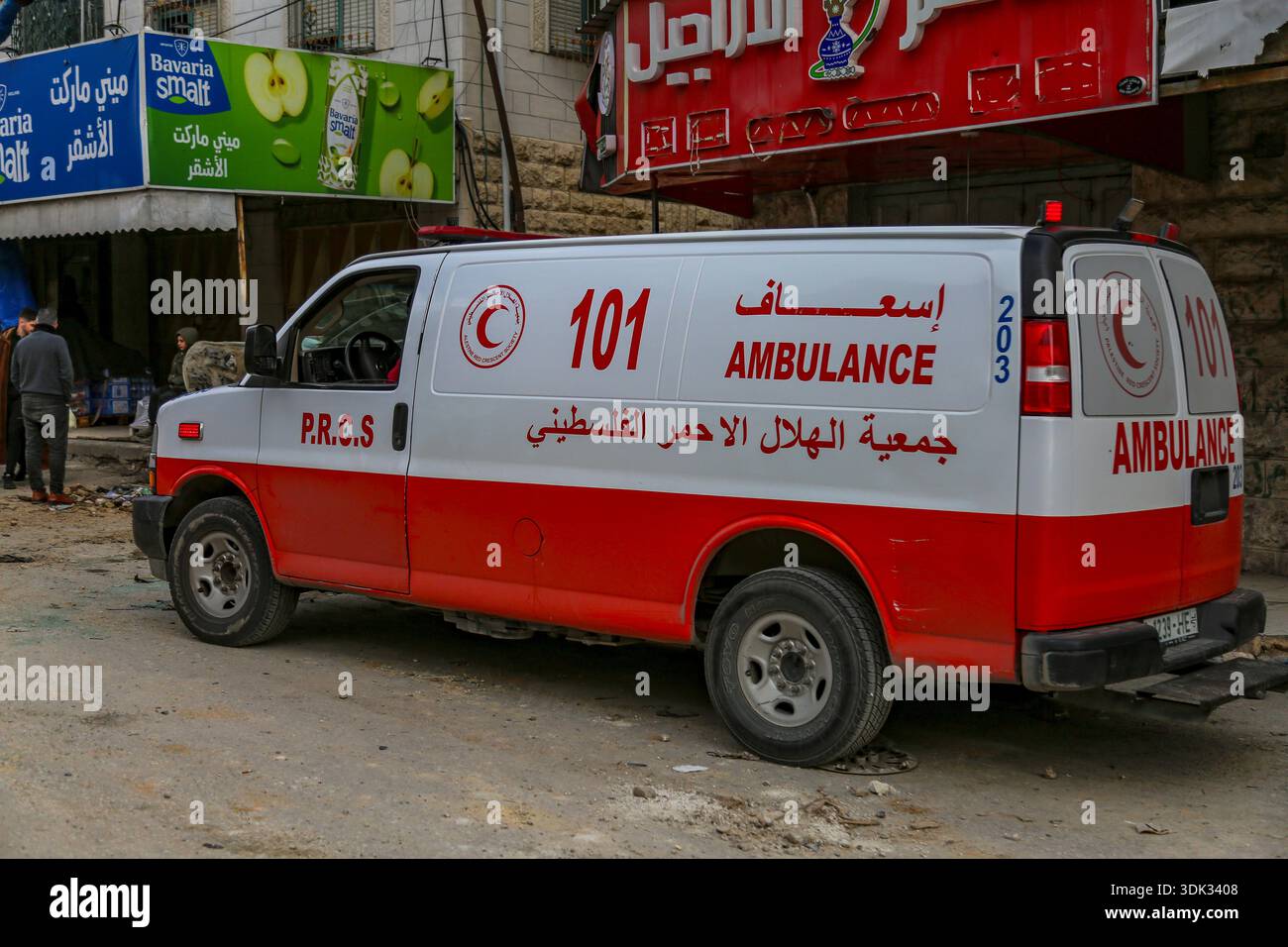 A Palestinian Red Crescent ambulance is stopped at a checkpoint during ...