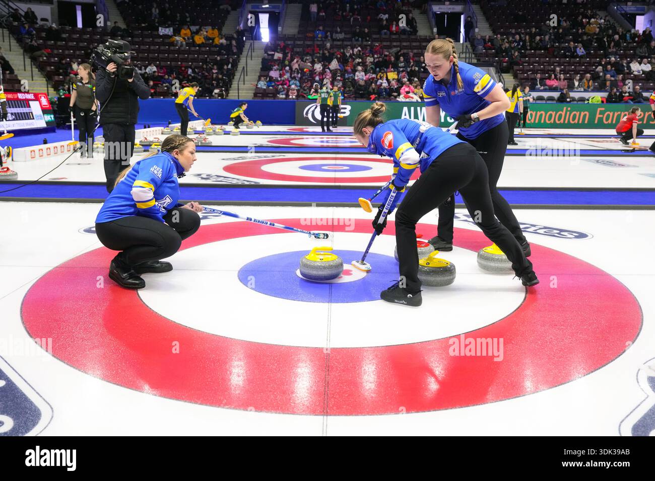 Alberta-Sturmay's skip Selena Sturmay, left, guides a stone towards the ...
