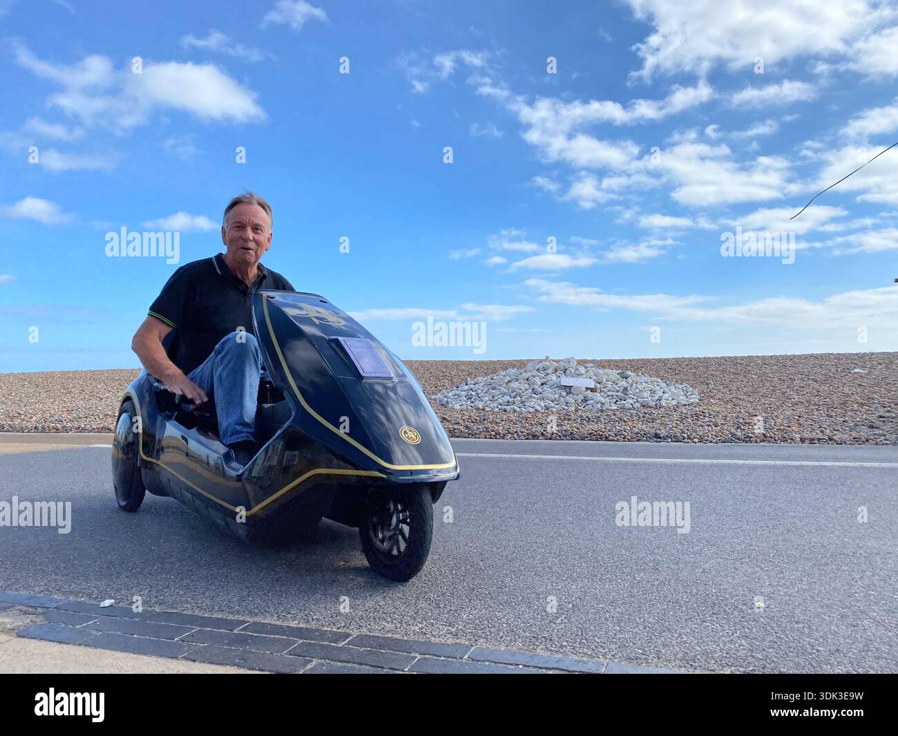 Senior man piloting a Replica Sinclair C5 in iconic John Player Special ...