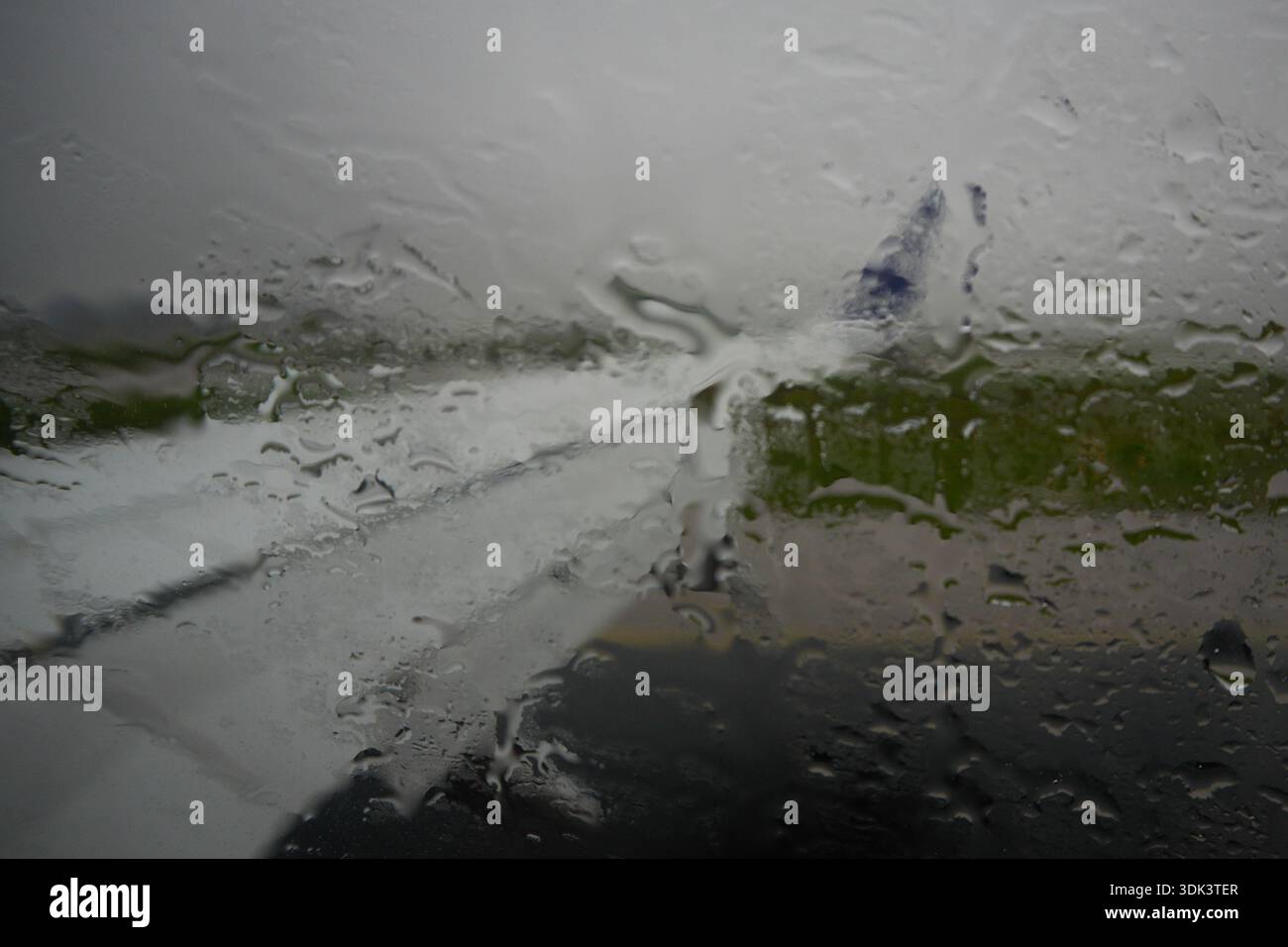 Rain drops are seen on the window of a Boeing 737 airliner in Athens ...