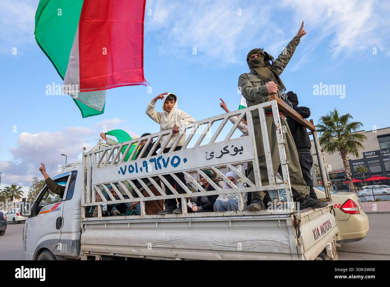 Kurdish protesters wave national flags as they demonstrate in support ...