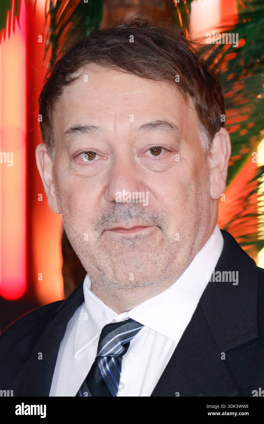 Director Sam Raimi poses for photographers upon arrival at the premiere ...