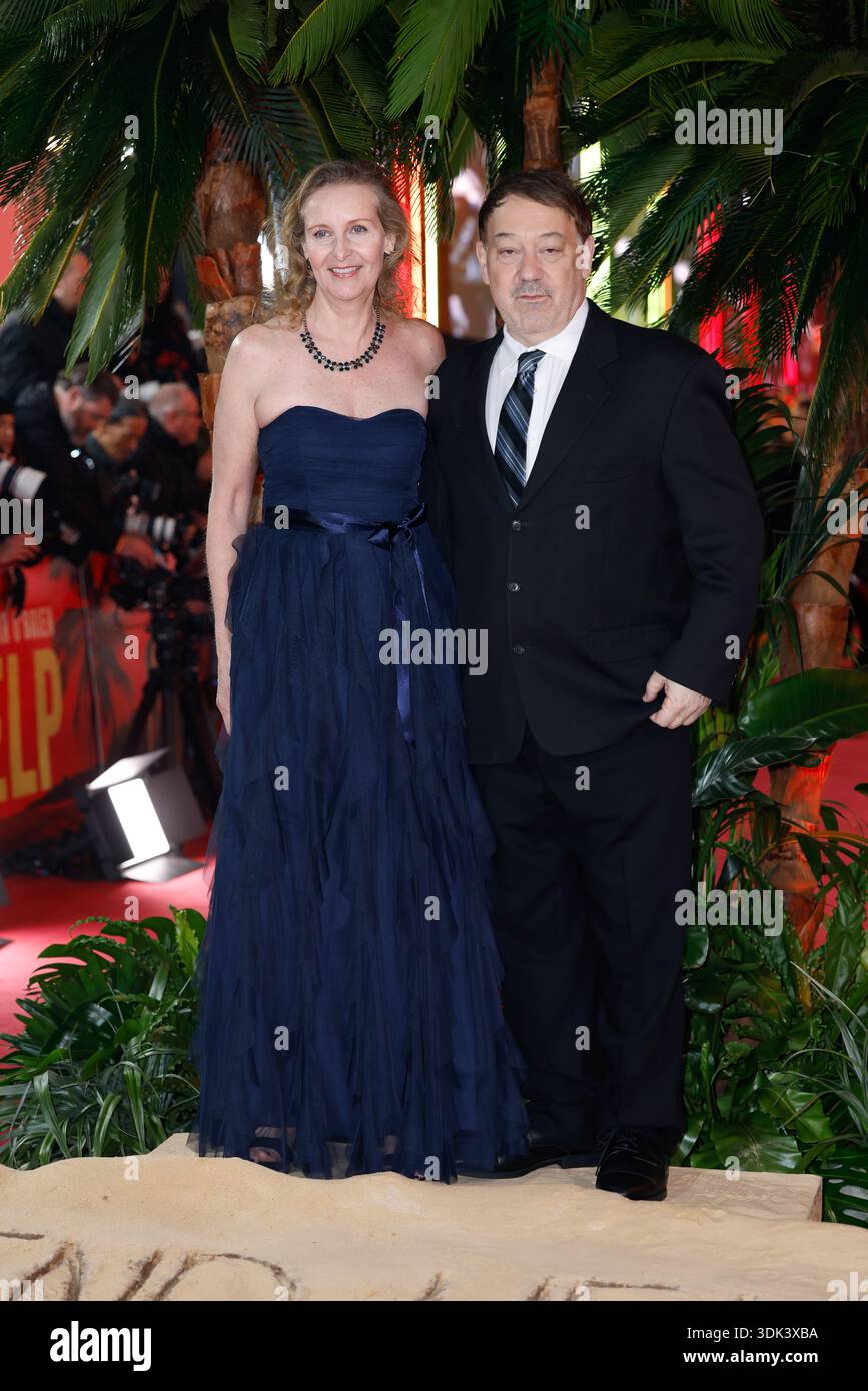 Yvonne Flores, left, and director Sam Raimi pose for photographers upon ...