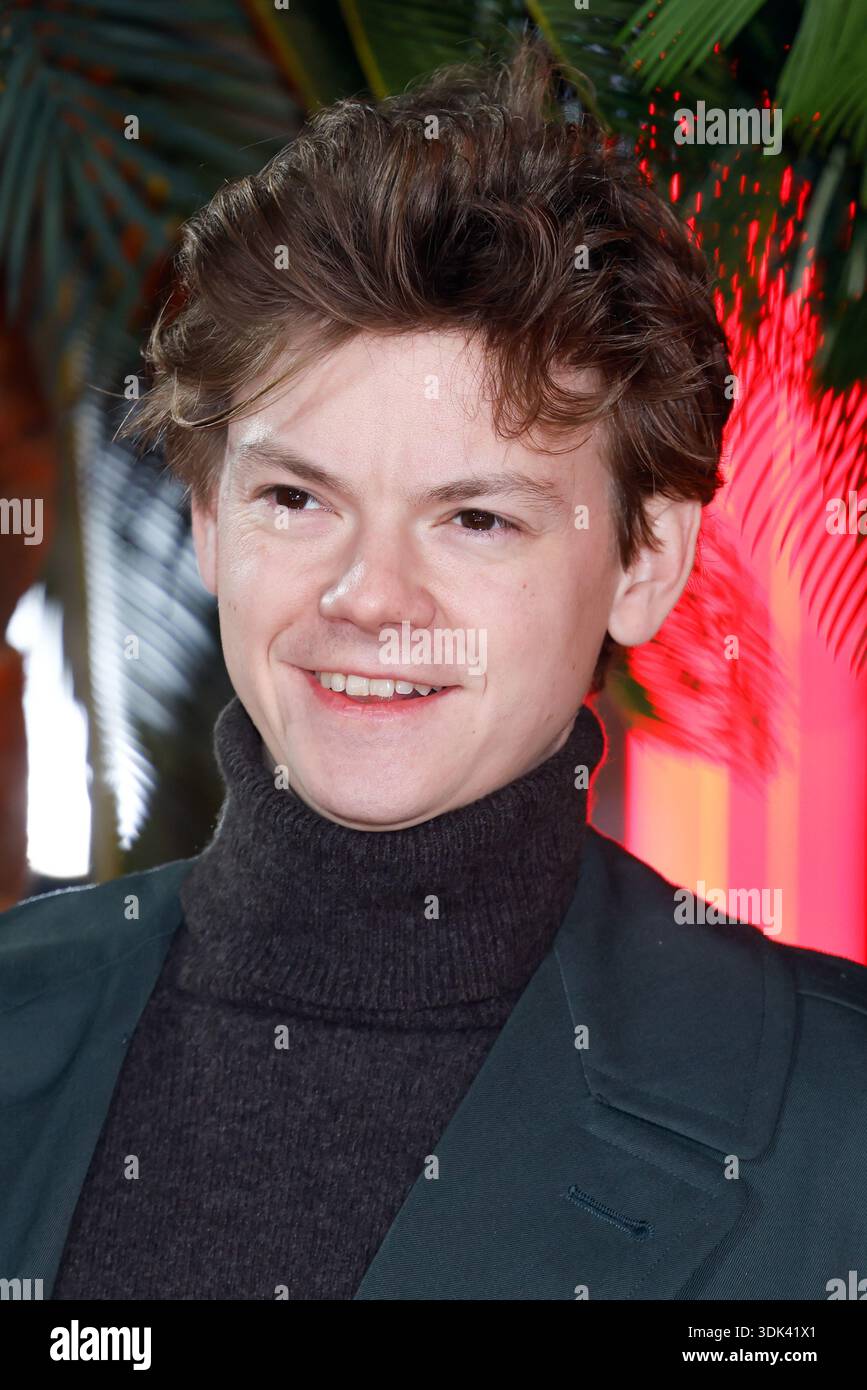 Thomas Brodie-Sangster poses for photographers upon arrival at the ...