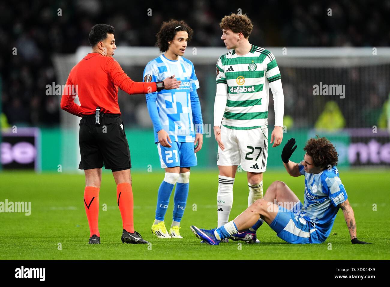 Celtic's Arne Engels is shown a yellow card by referee Mohammed Al ...