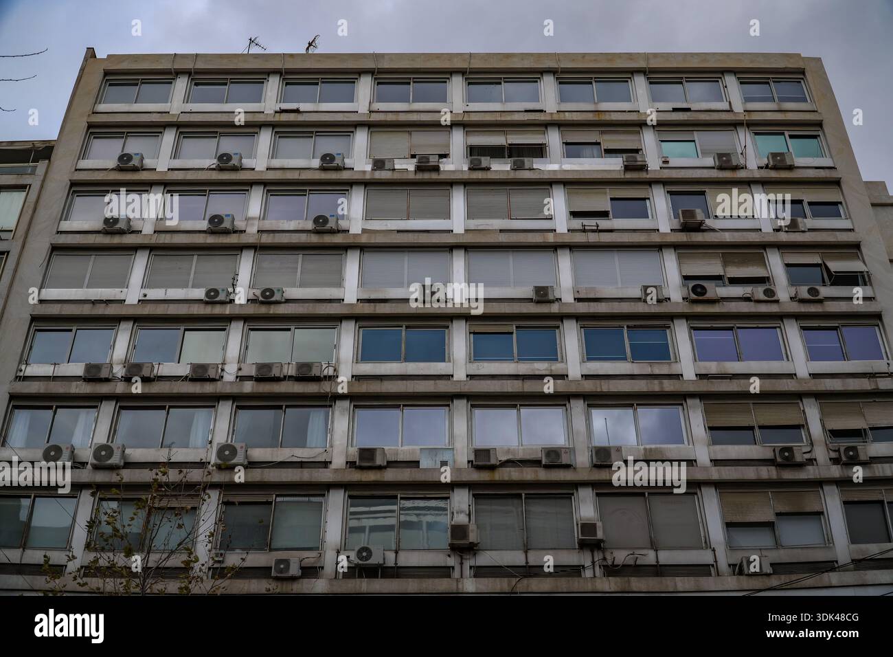 Athens building facade. Concrete, repetitive windows, and numerous ...