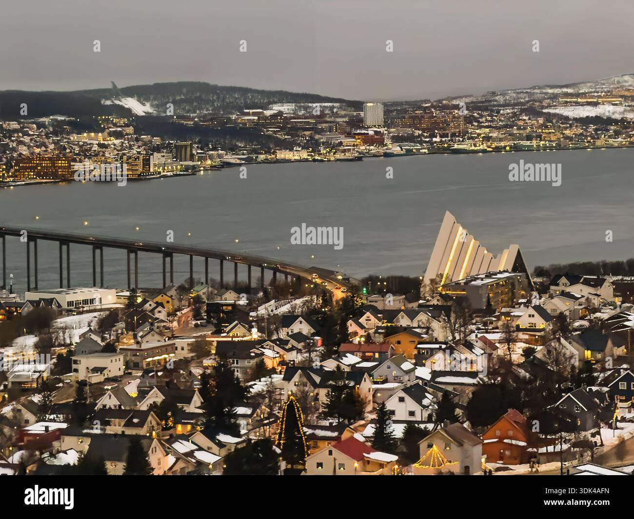 Tromso, Norway - December 22, 2025: Winter polar night. Tromso bridge ...