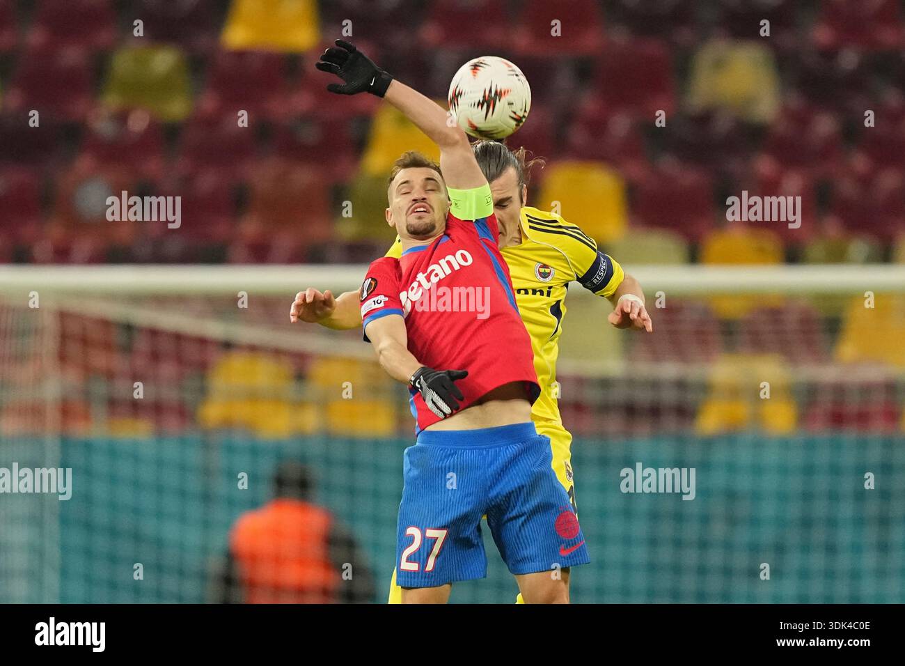 Fenerbahce's Caglar Soyuncu, right, jumps for a header with FCSB's ...