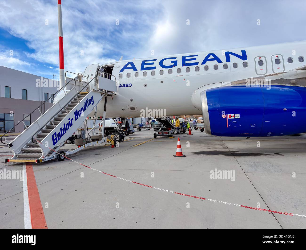 Aegean Airlines Airbus A320 aircraft fuselage parked at an airport gate ...