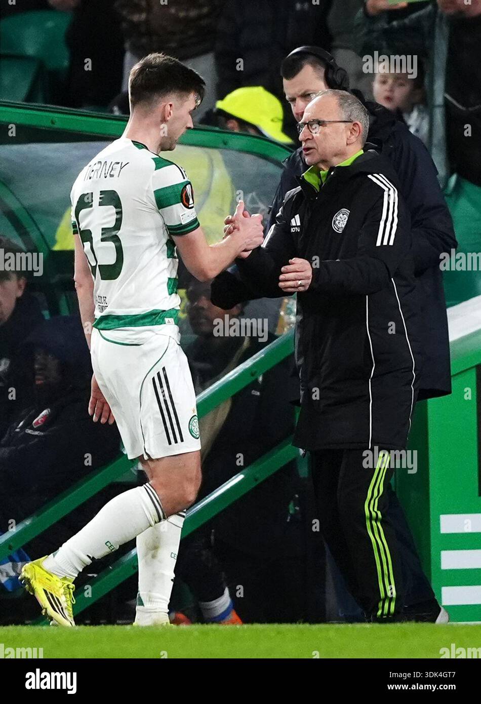 Celtic's Kieran Tierney (left) is congratulated by interim manager ...