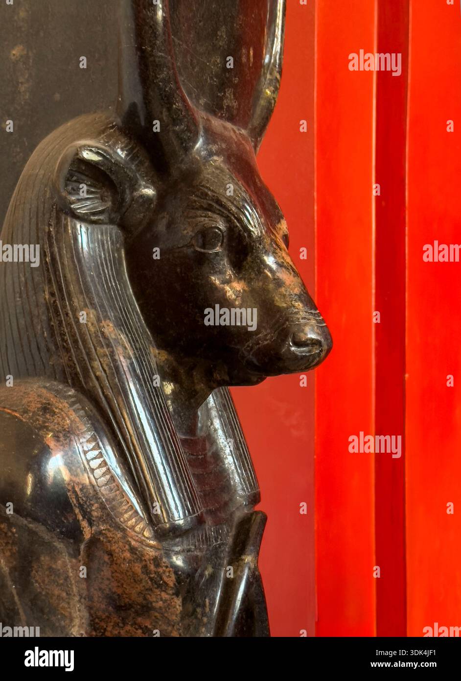 An ancient Egyptian statue of the god Apis, depicted with a human body ...