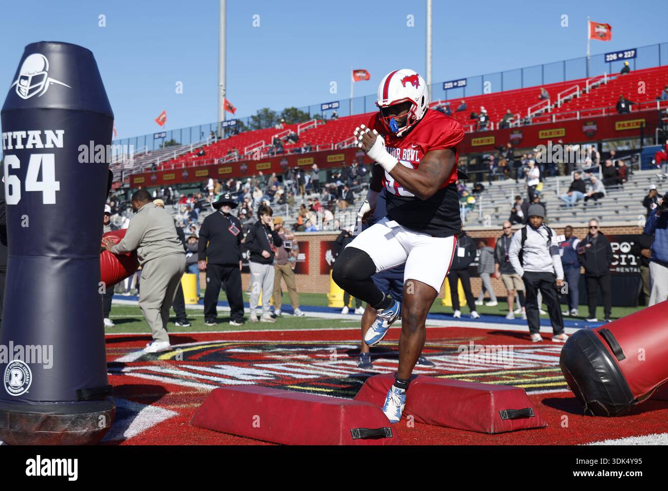 National Team defensive tackle Jeffrey M'ba (99), of SMU, runs through ...