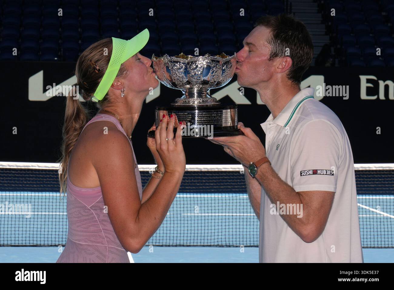 Australia's Olivia Gadecki and John Peers kiss their trophy after ...