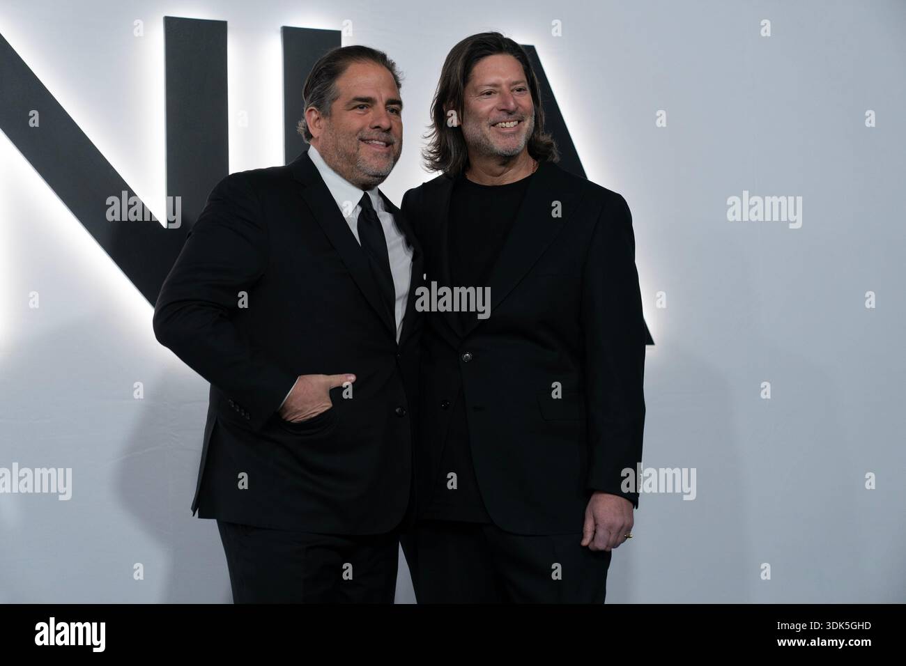 Brett Ratner, left, and Marc Beckman pose for photographers as they ...