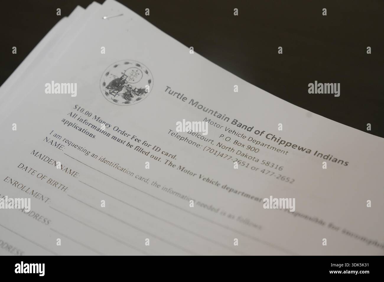 Paperwork to apply for a tribal identification card is displayed Friday ...