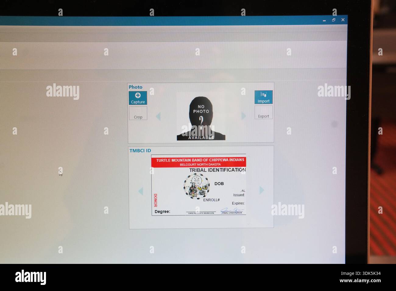 A template of a tribal identification card is displayed on a computer ...