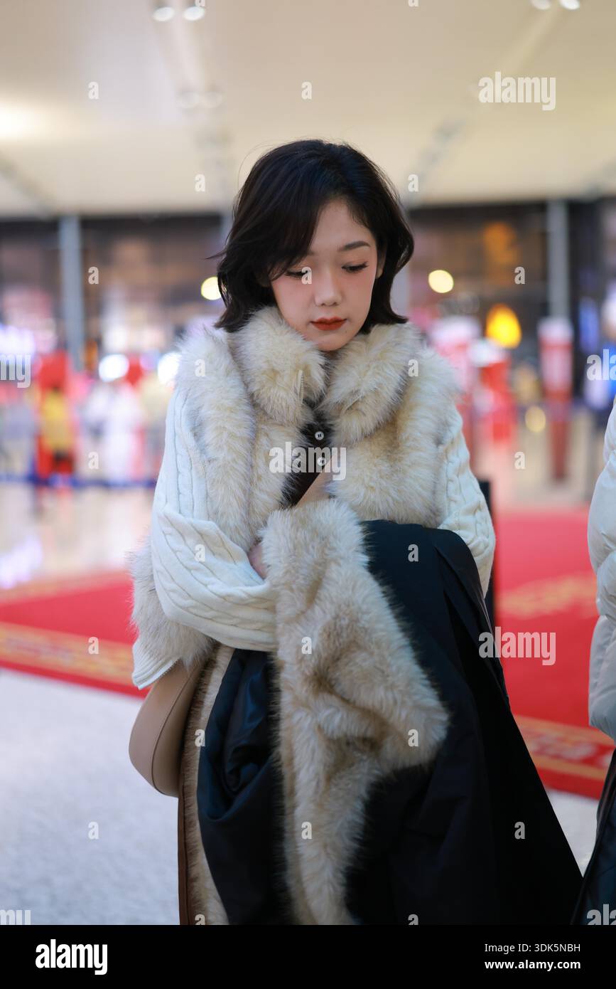 Chinese singer-songwriter Curley G appears at the airport in Shanghai ...