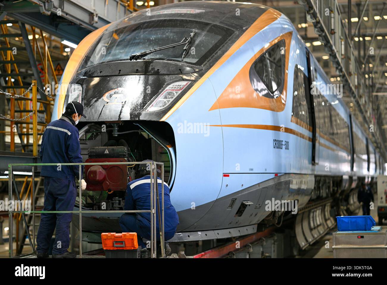 NANJING, CHINA - JANUARY 30, 2026 - Ground mechanics perform cleaning ...