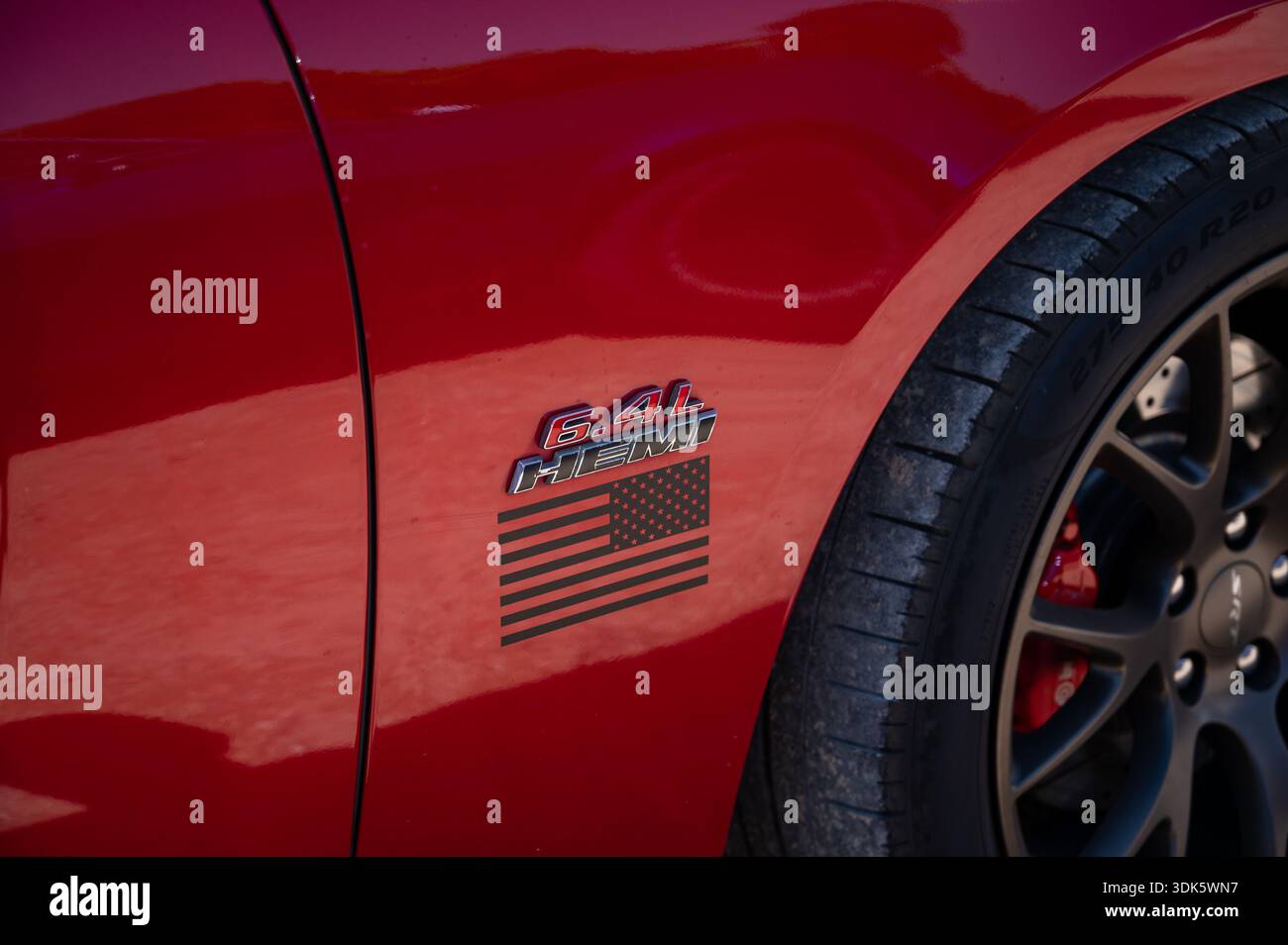 A detailed close-up of the 6.4L HEMI badge and an American flag decal ...