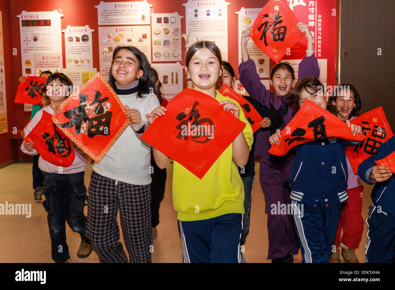 Children and teachers write Spring Festival couplets at a primary ...
