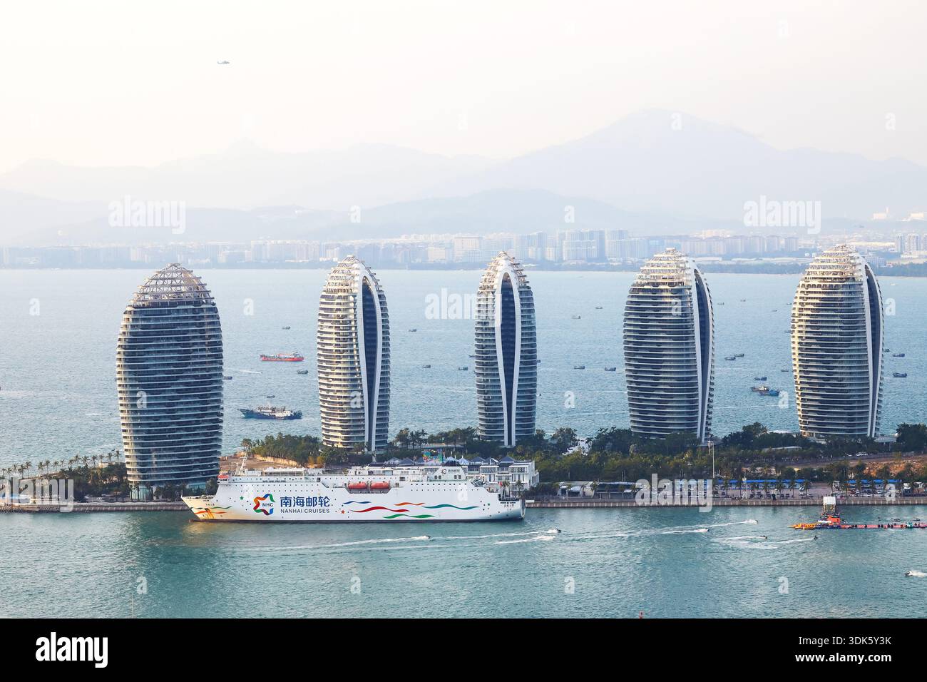 SANYA, CHINA - JANUARY 18, 2025 - A Nanhai cruise docks at the pier and ...