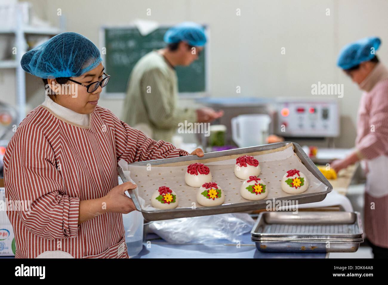 Artisans make colorful flower buns with various shapes at a workshop in ...