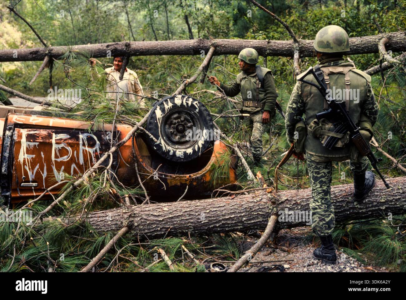 Soldiers from the Guatemalan miltary begin to dismantle an EGP guerilla ...