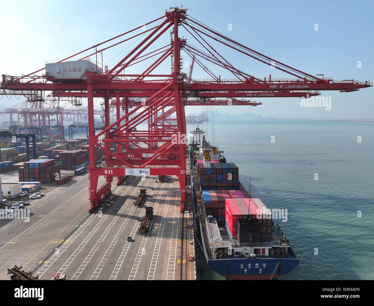 Cargo ships dock at a container terminal in Lianyungang Port ...