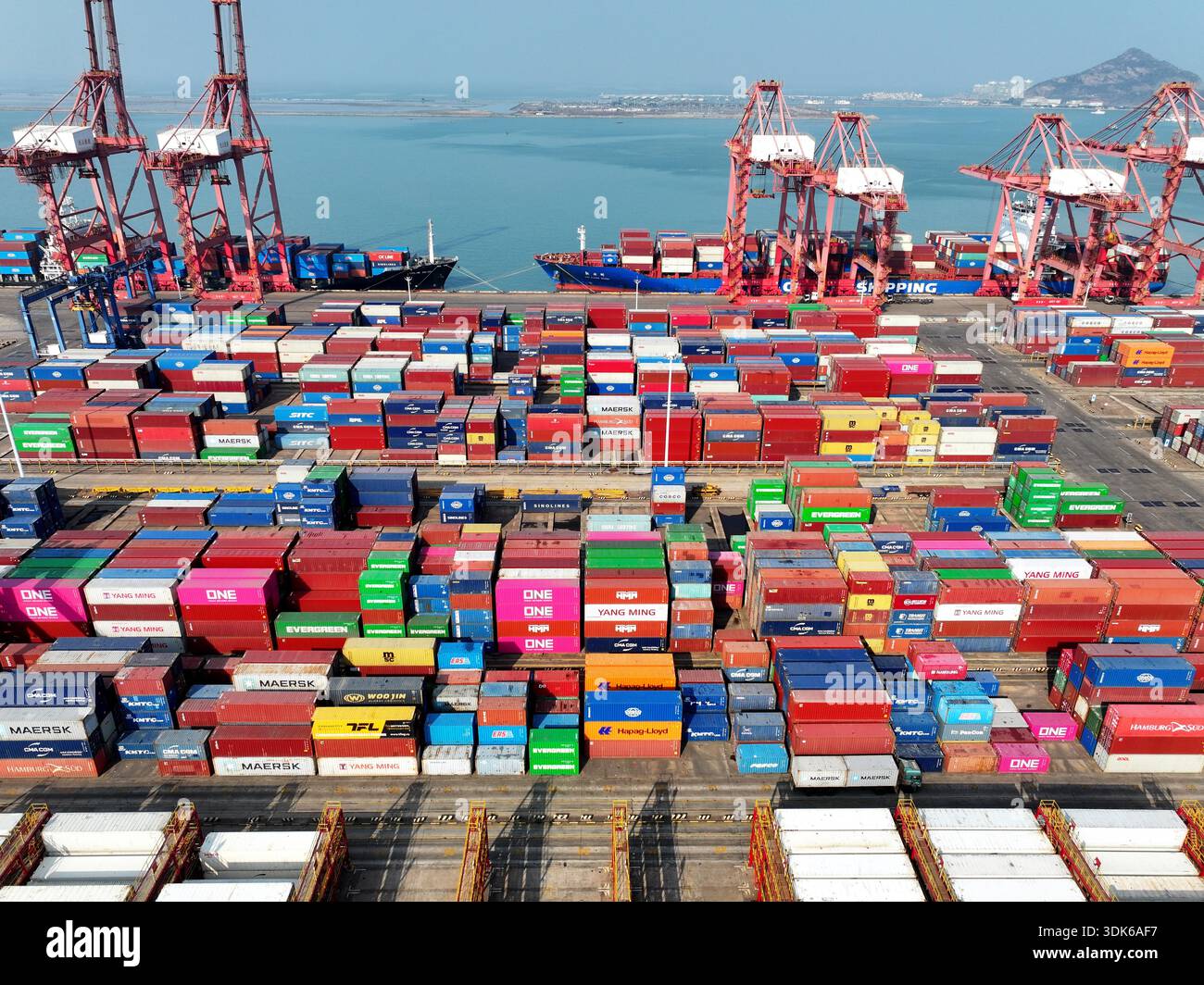Cargo ships dock at a container terminal in Lianyungang Port ...