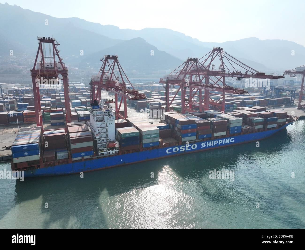 Cargo ships dock at a container terminal in Lianyungang Port ...