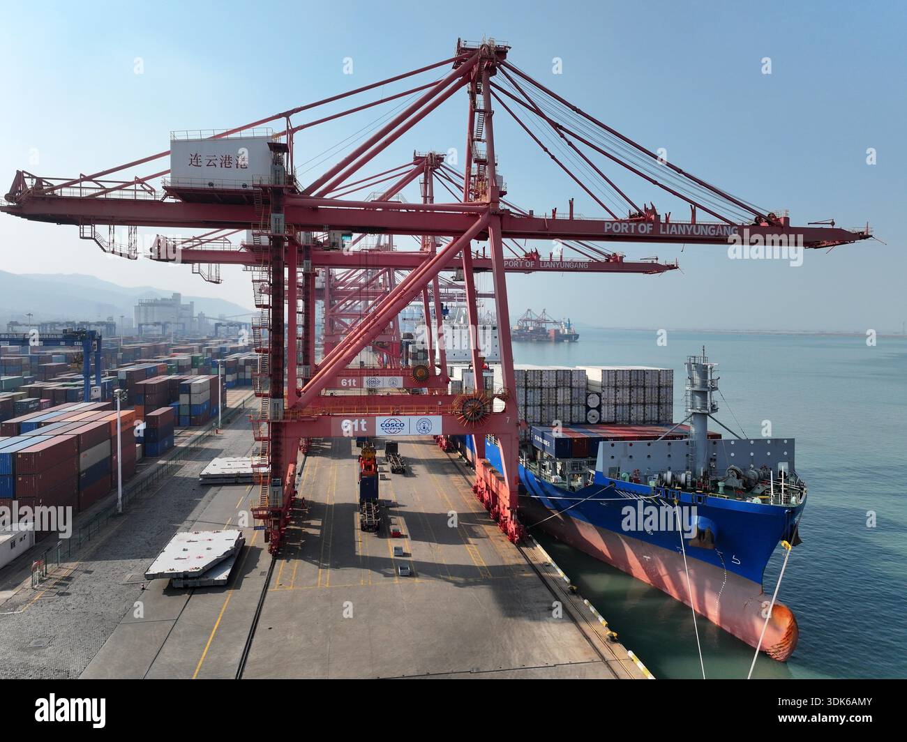 Cargo ships dock at a container terminal in Lianyungang Port ...
