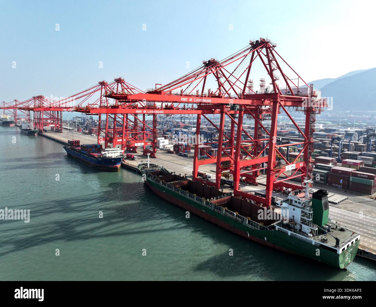 Cargo ships dock at a container terminal in Lianyungang Port ...
