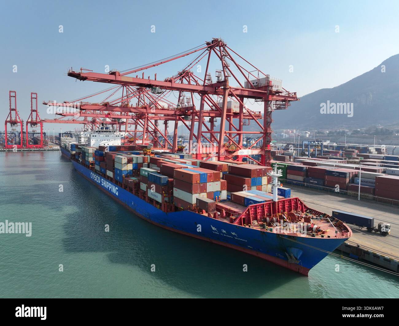 Cargo ships dock at a container terminal in Lianyungang Port ...