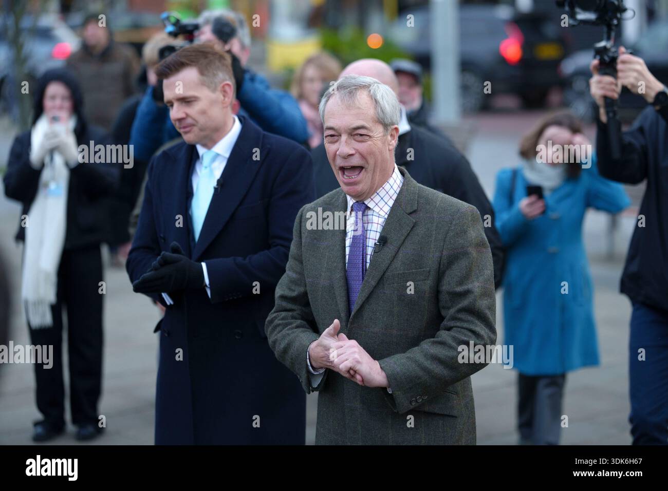 Reform leader Nigel Farage, centre, walks with prospective candidate ...