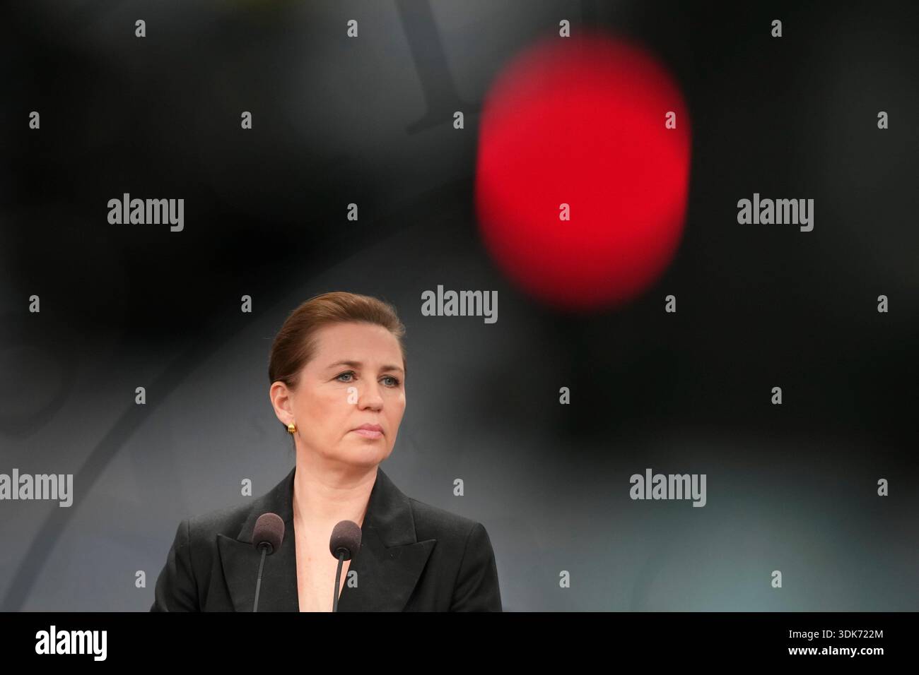Denmark's Prime Minister Mette Frederiksen looks on as she presents the ...