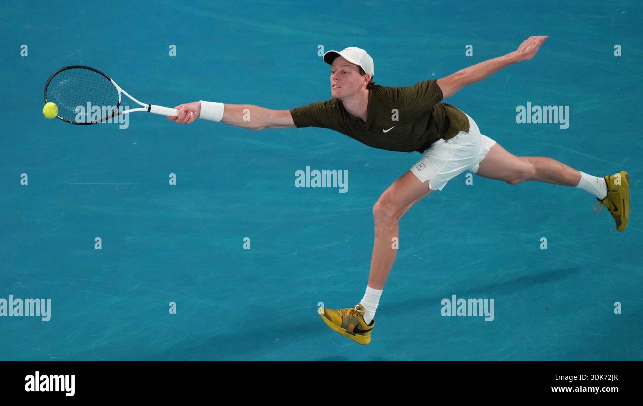 Jannik Sinner of Italy plays a forehand return to Novak Djokovic of ...
