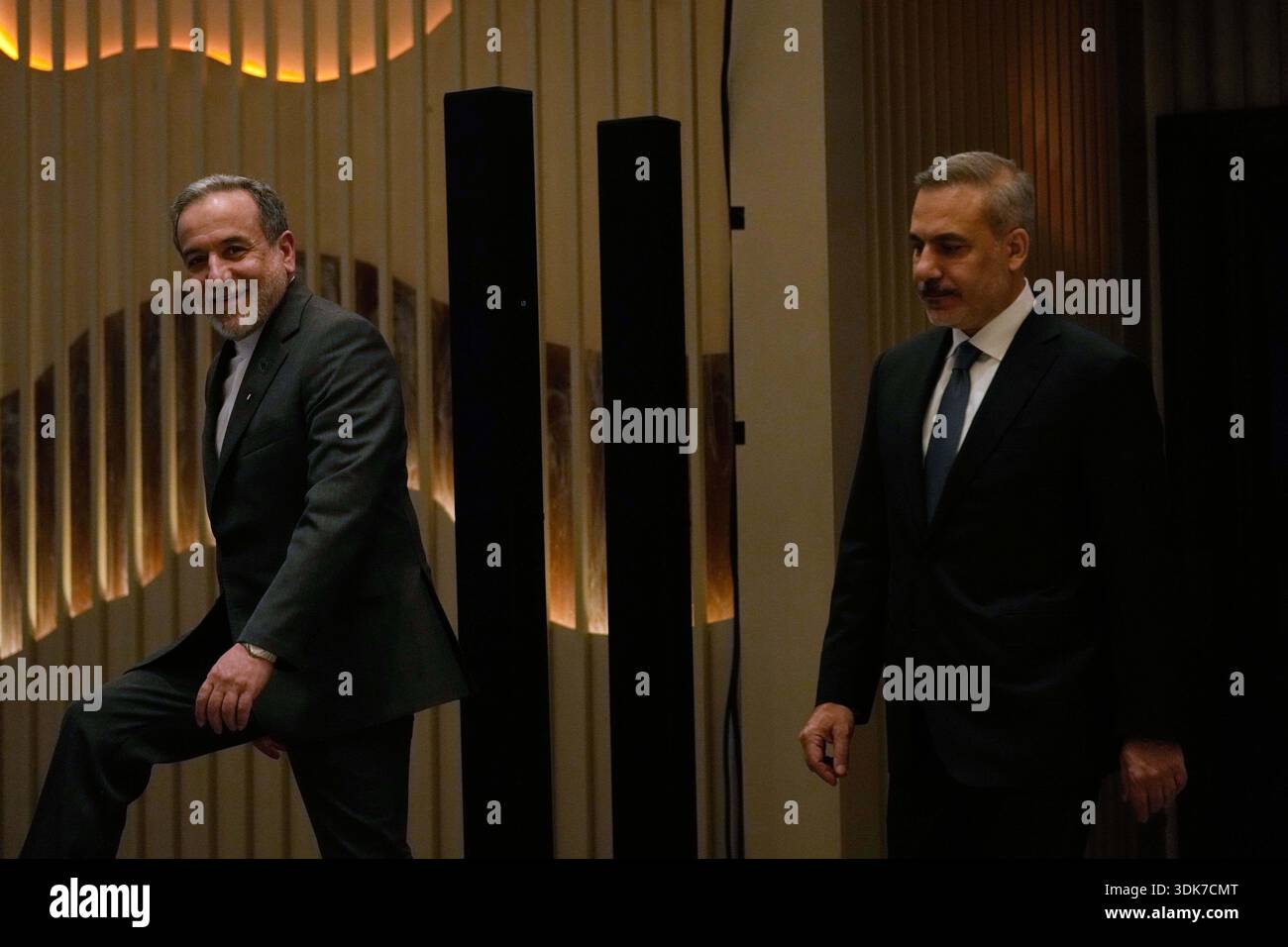 Iranian Foreign Minister Abbas Araghchi, left, smiles as he arrives ...