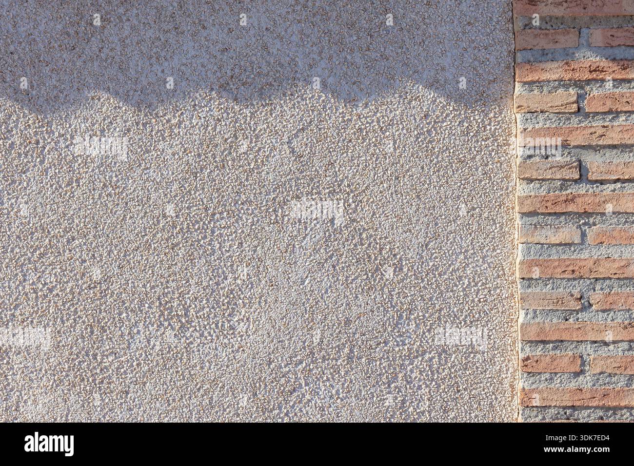 Light beige rough pebbledash stucco and red brick masonry. Highlights ...