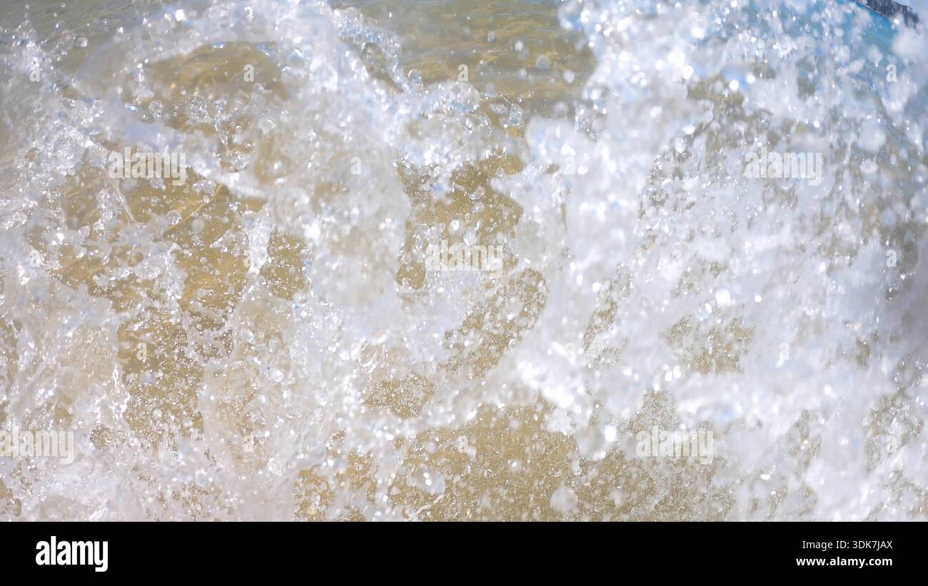 Background waves splattering water splashing still, frozen in motion ...