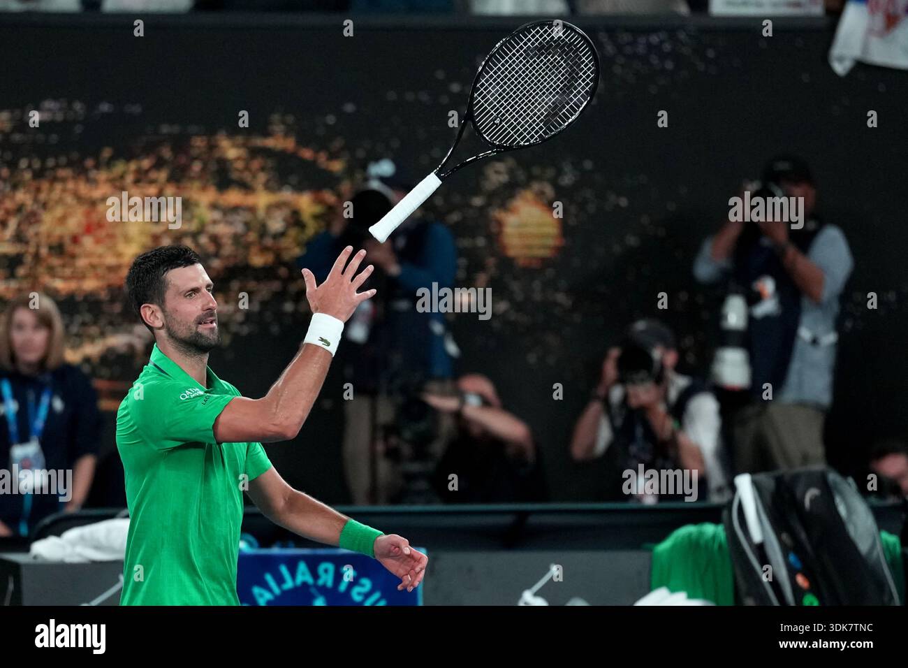 Novak Djokovic of Serbia throws his racket as he celebrates after ...