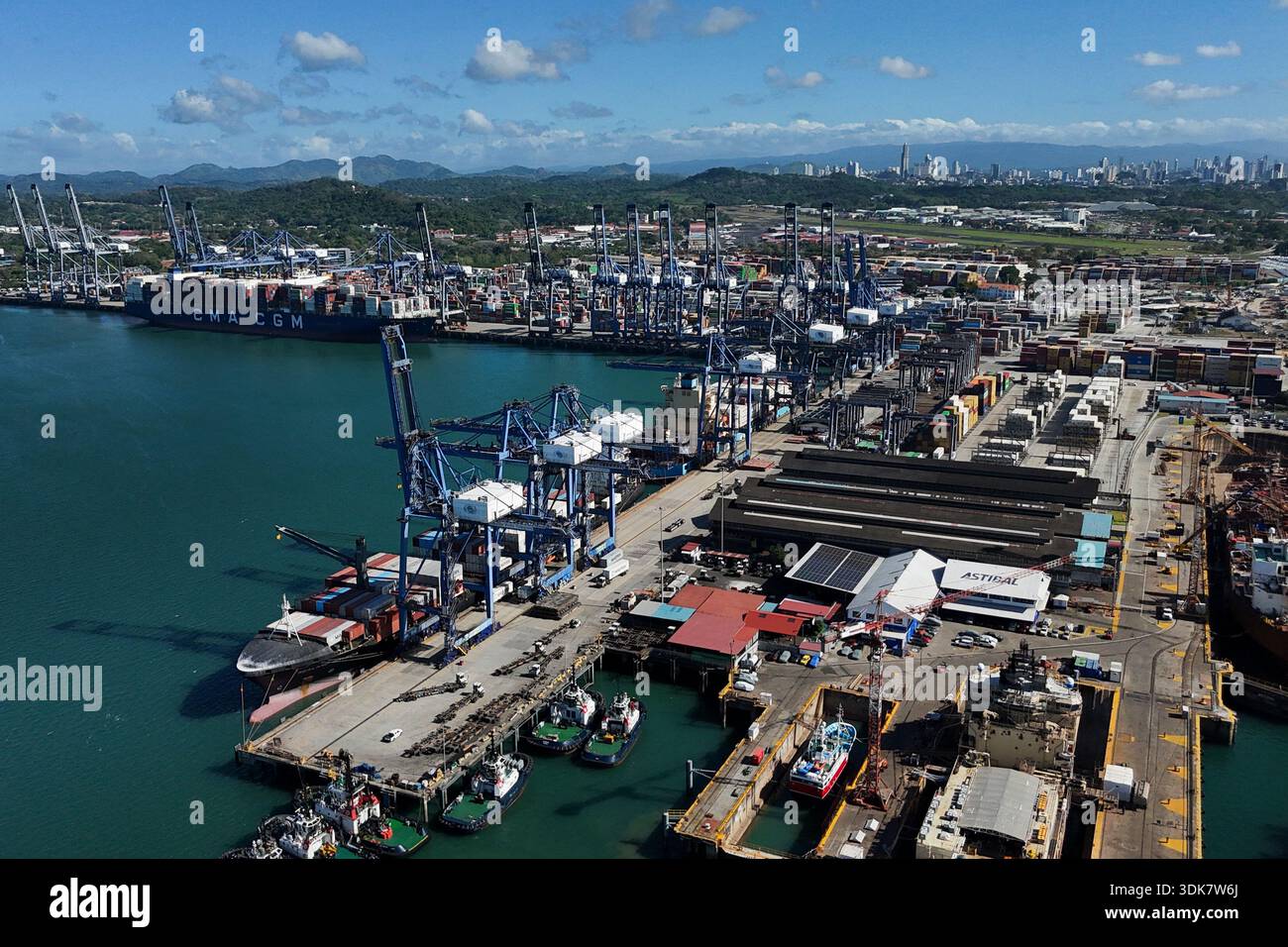 Cranes load a cargo ship at Panama Canal's Port of Balboa, managed by ...