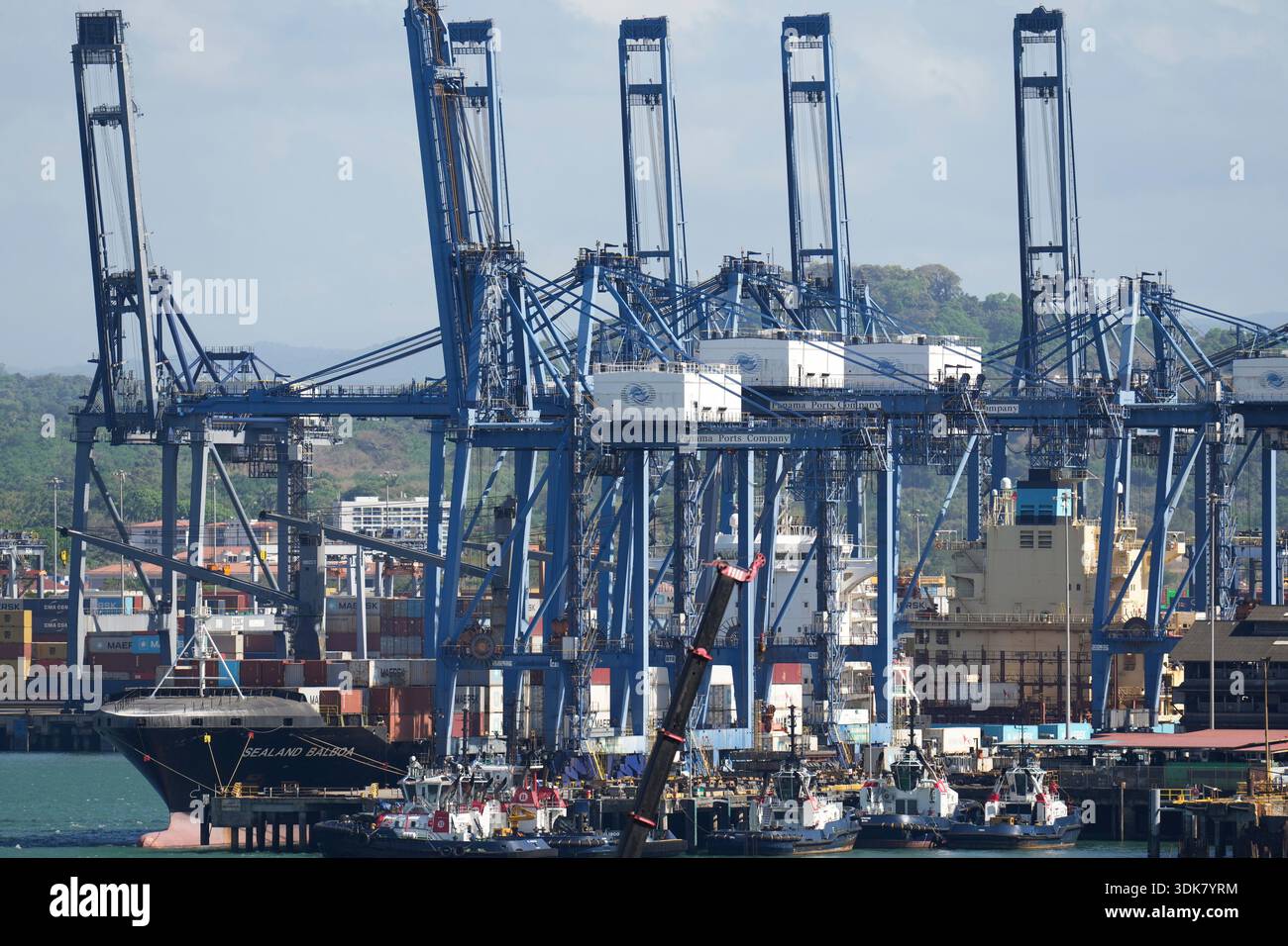 Cranes load a cargo ship at Panama Canal's Port of Balboa, managed by ...