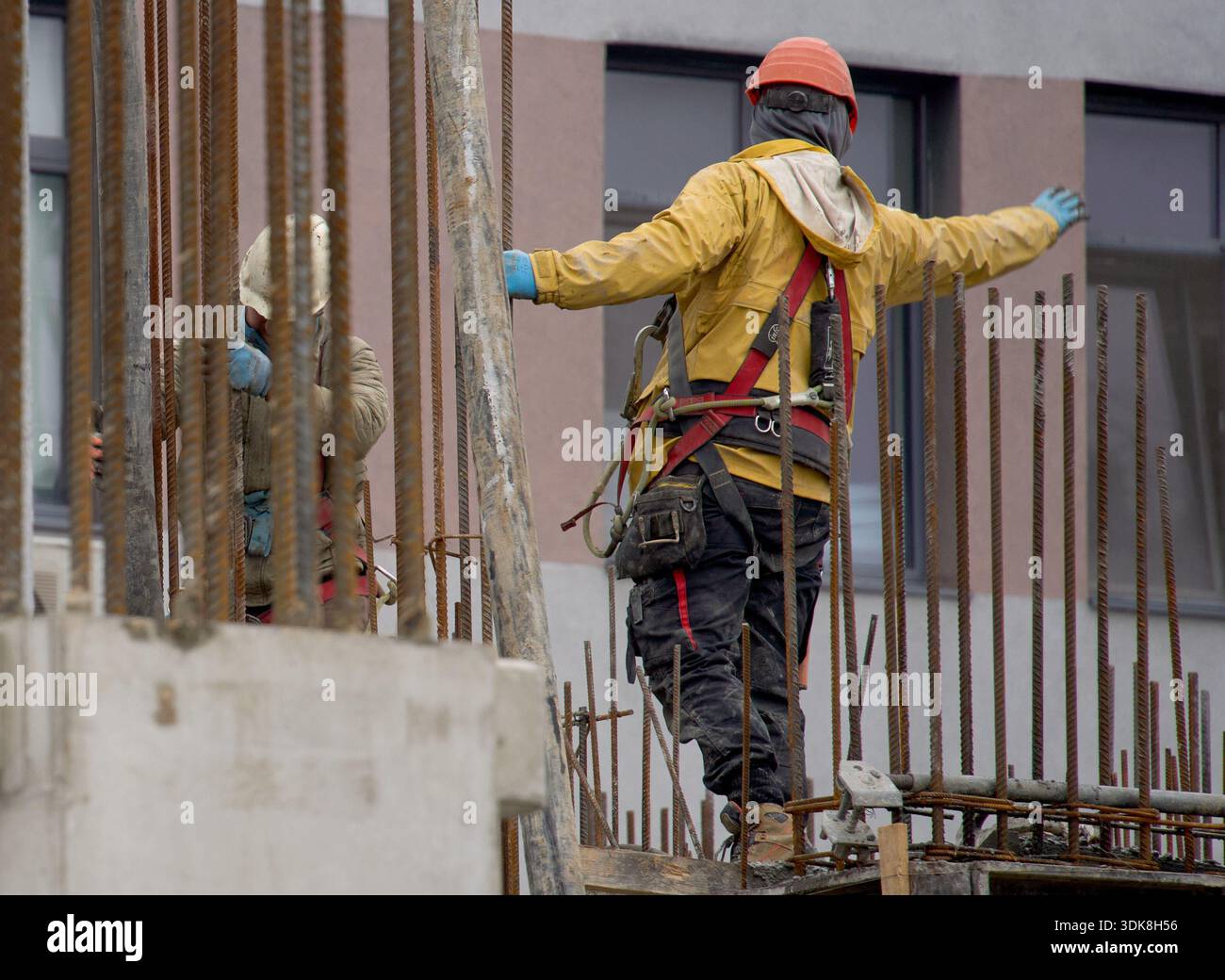 Bucharest, Romania. 30th Jan, 2026: Builders pour concrete as the ...