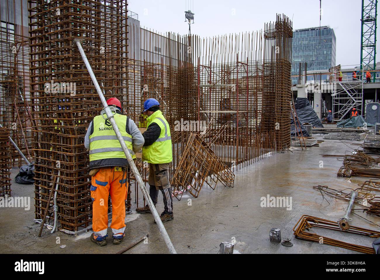 Bucharest, Romania. 30th Jan, 2026: Builders tie rebar as Romanian ...