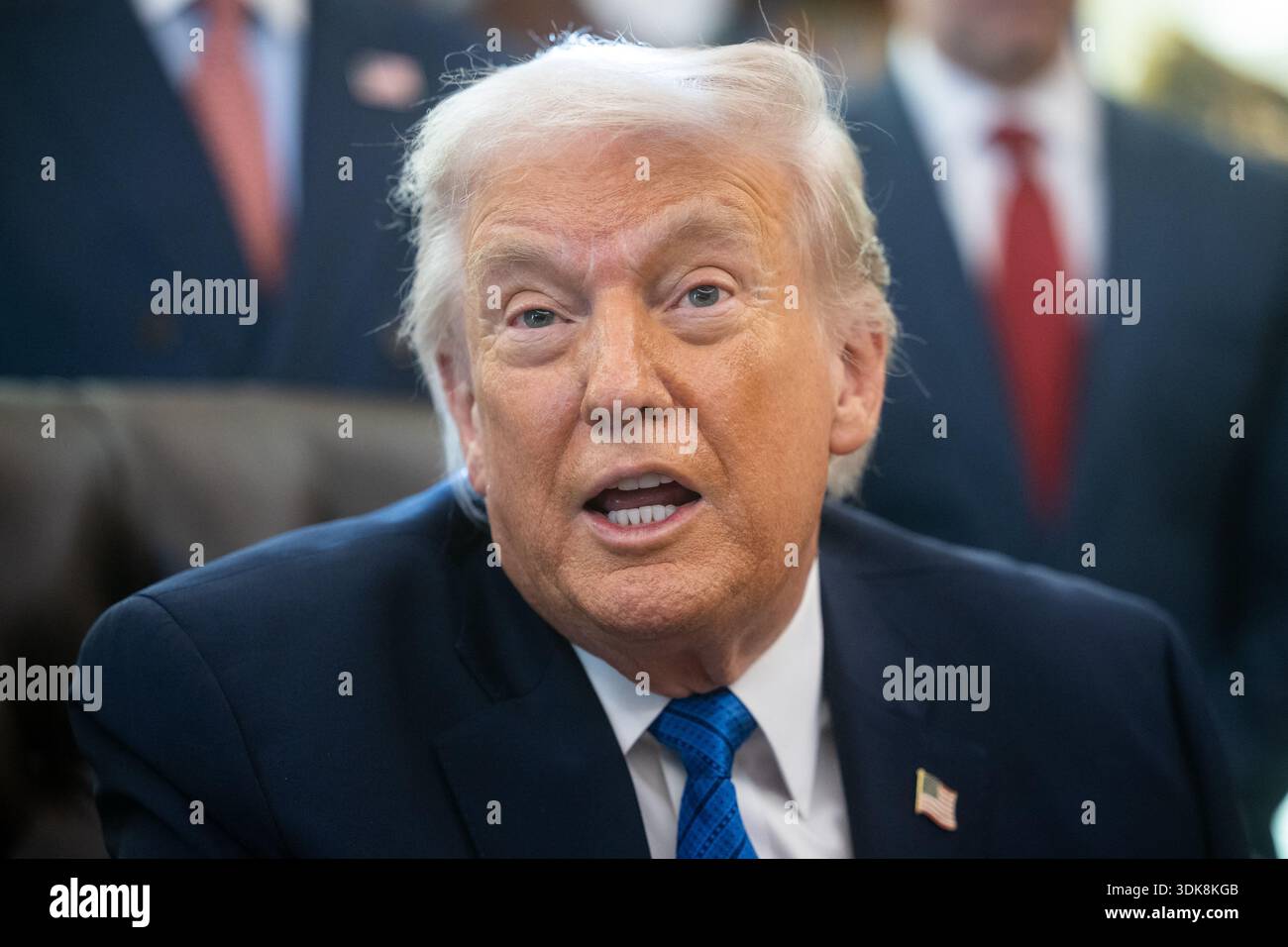 President Donald Trump signs executive orders in the Oval Office at the ...