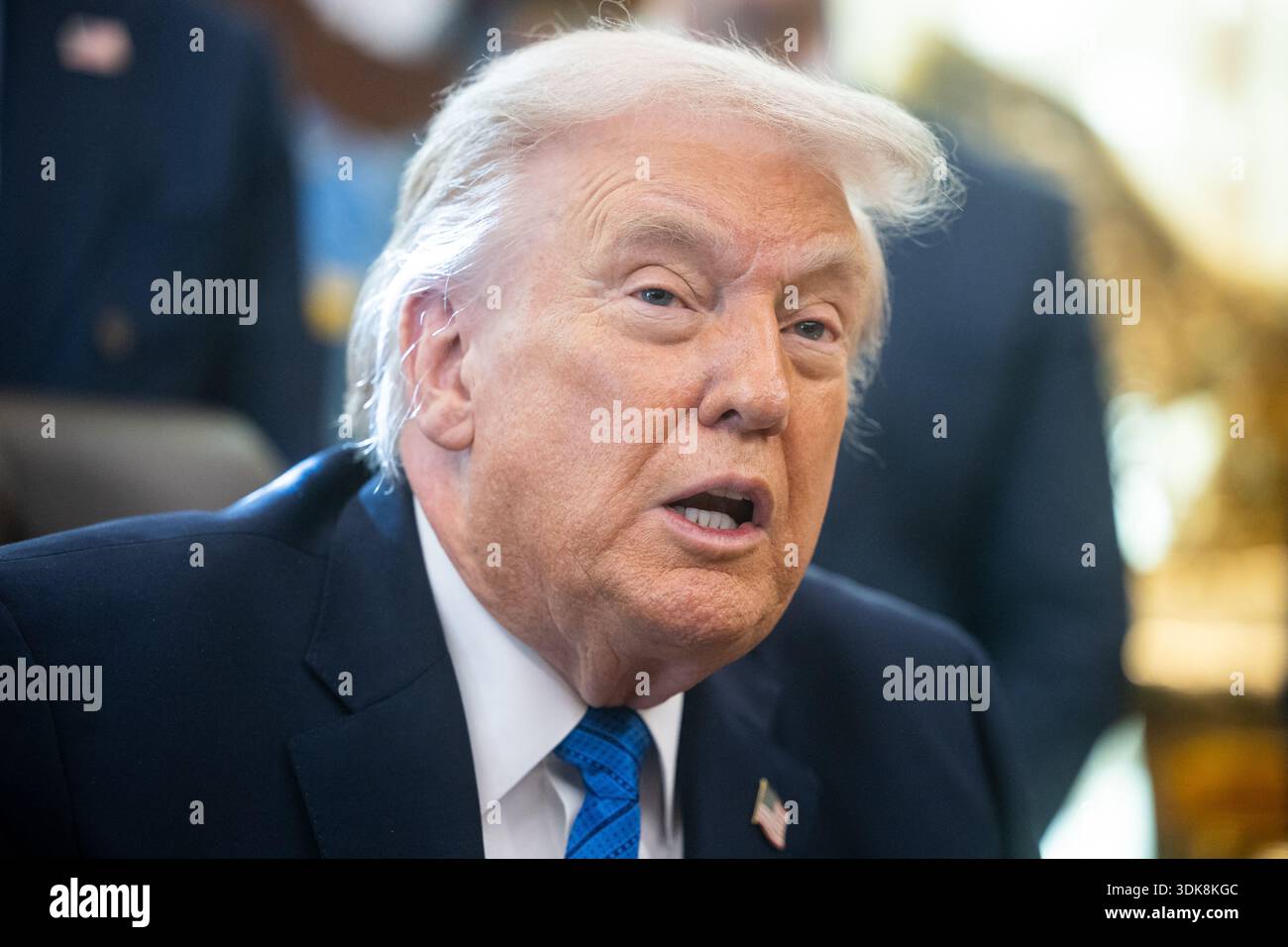 President Donald Trump signs executive orders in the Oval Office at the ...