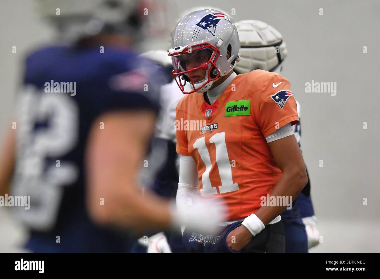 New England Patriots quarterback Joshua Dobbs (11) warms up during an ...