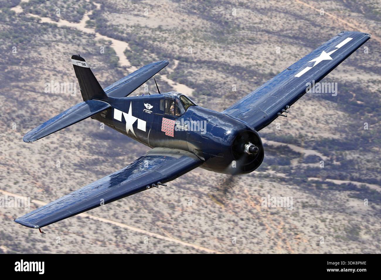 A Grumman F6F-5 Hellcat named Minsi III is shown in air-to-air flight ...